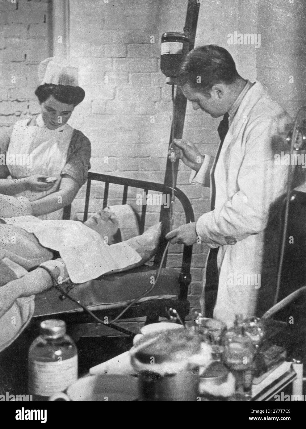 WW2 - Air raid victim undergoing blood transfusion in the underground ...