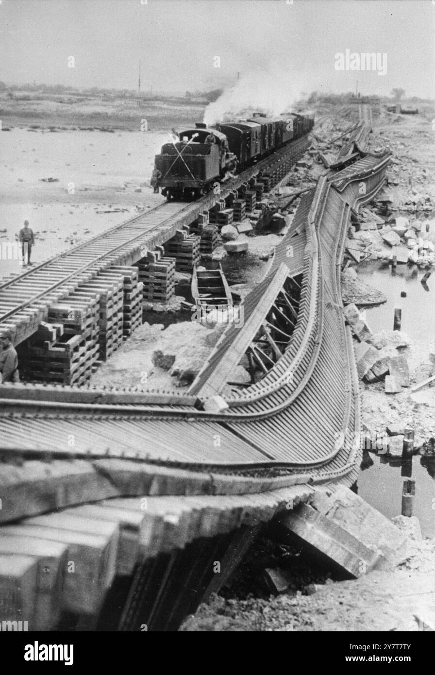 Sino-Japanese war - 1937-1939Steam train alongside a collapsed rail ...