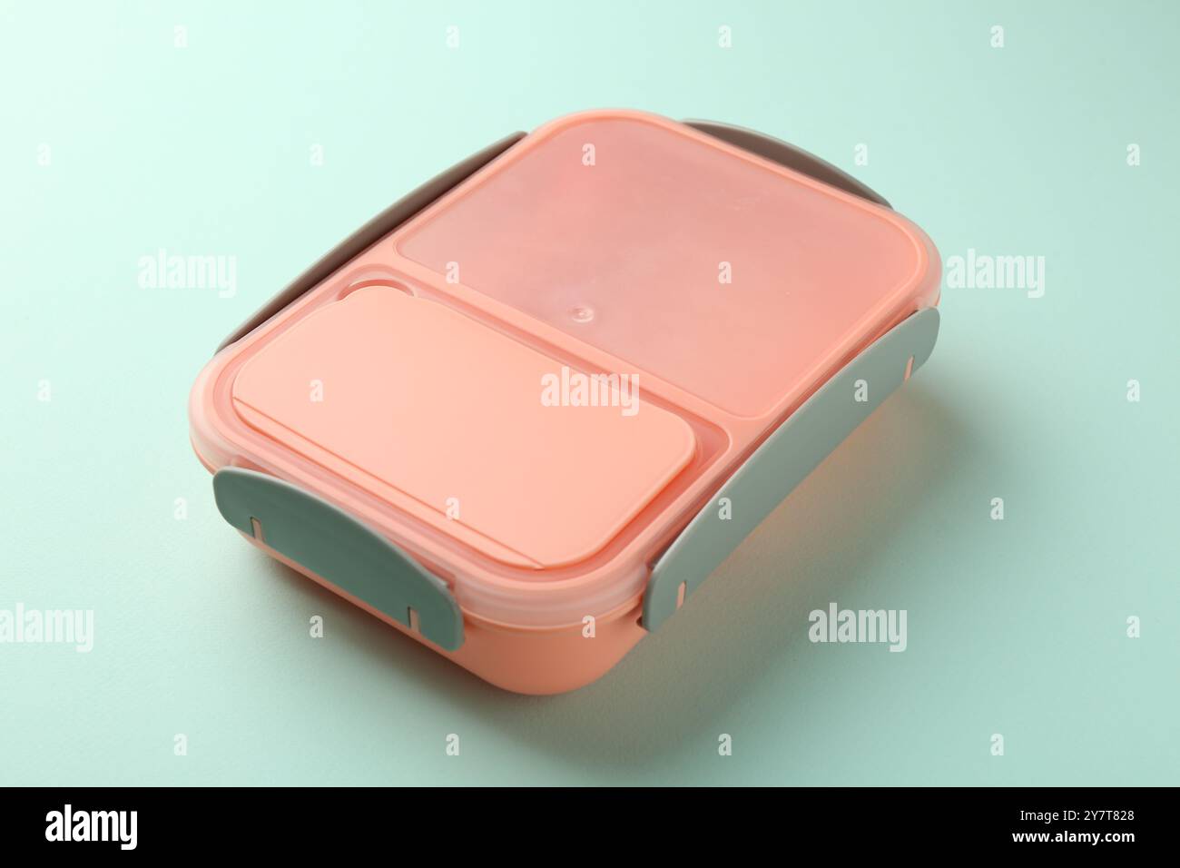 One empty lunch box on light blue background Stock Photo - Alamy