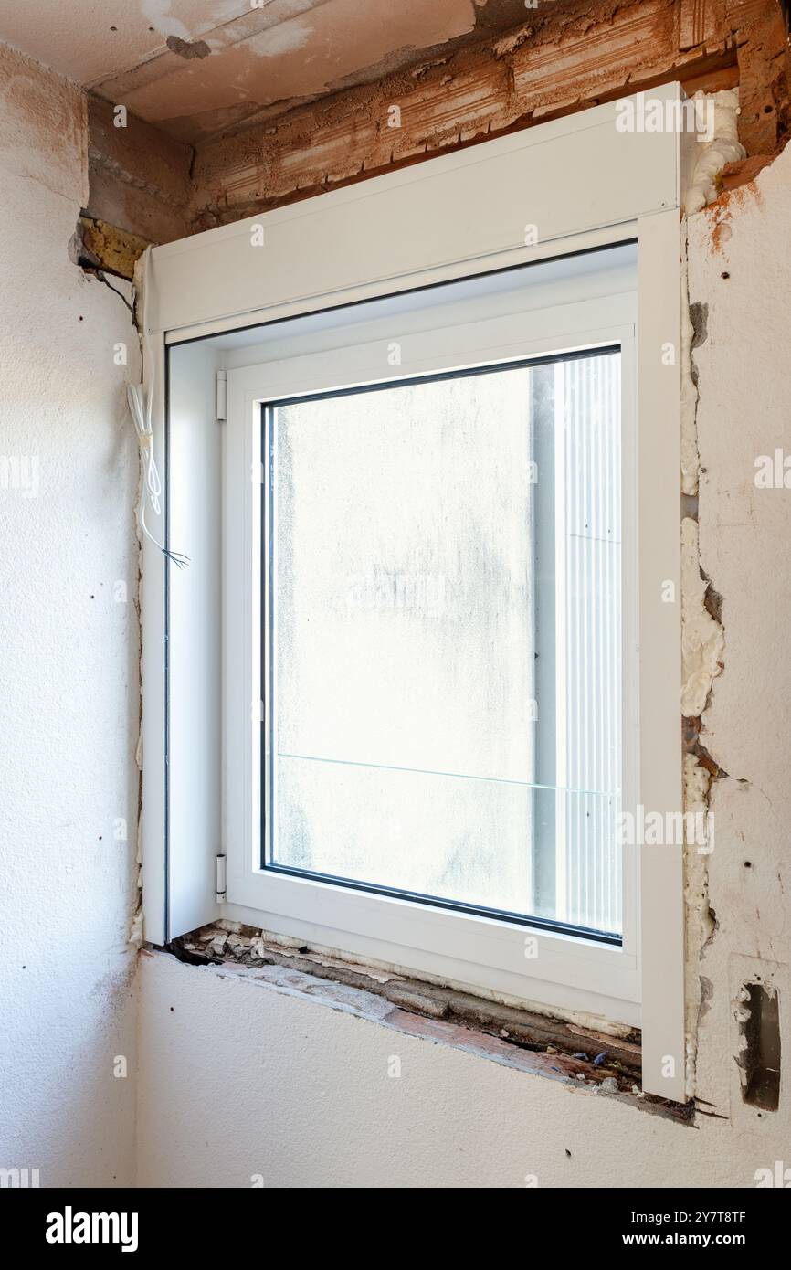 New window being installed in old house as part of a home renovation ...