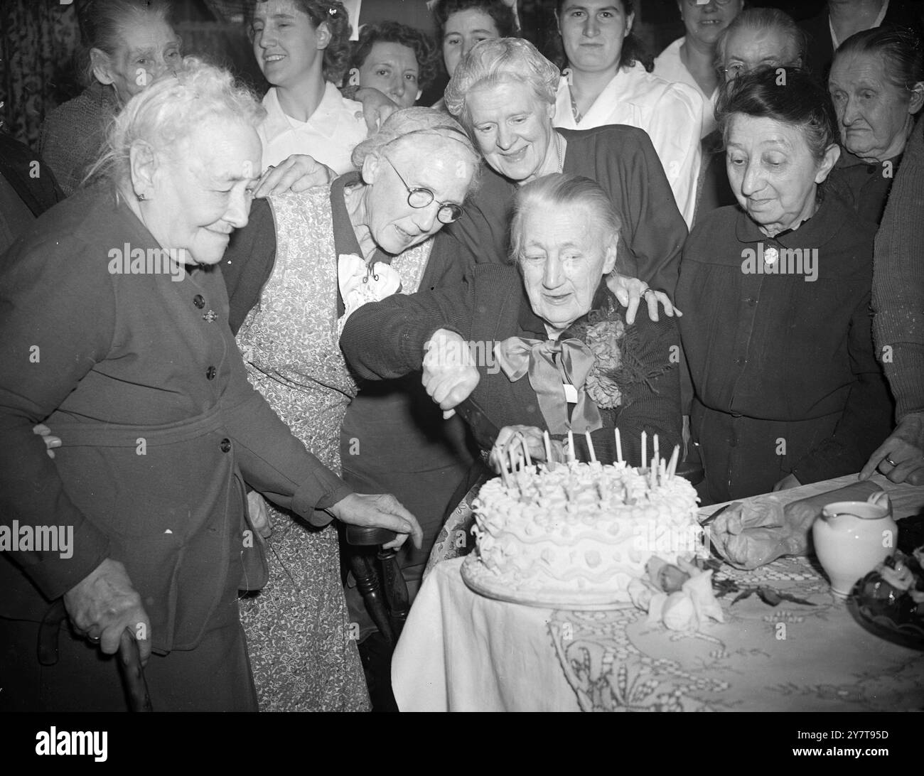 CELEBRATING A CENTURY Cutting the cake that marks her 100th birthday is ...