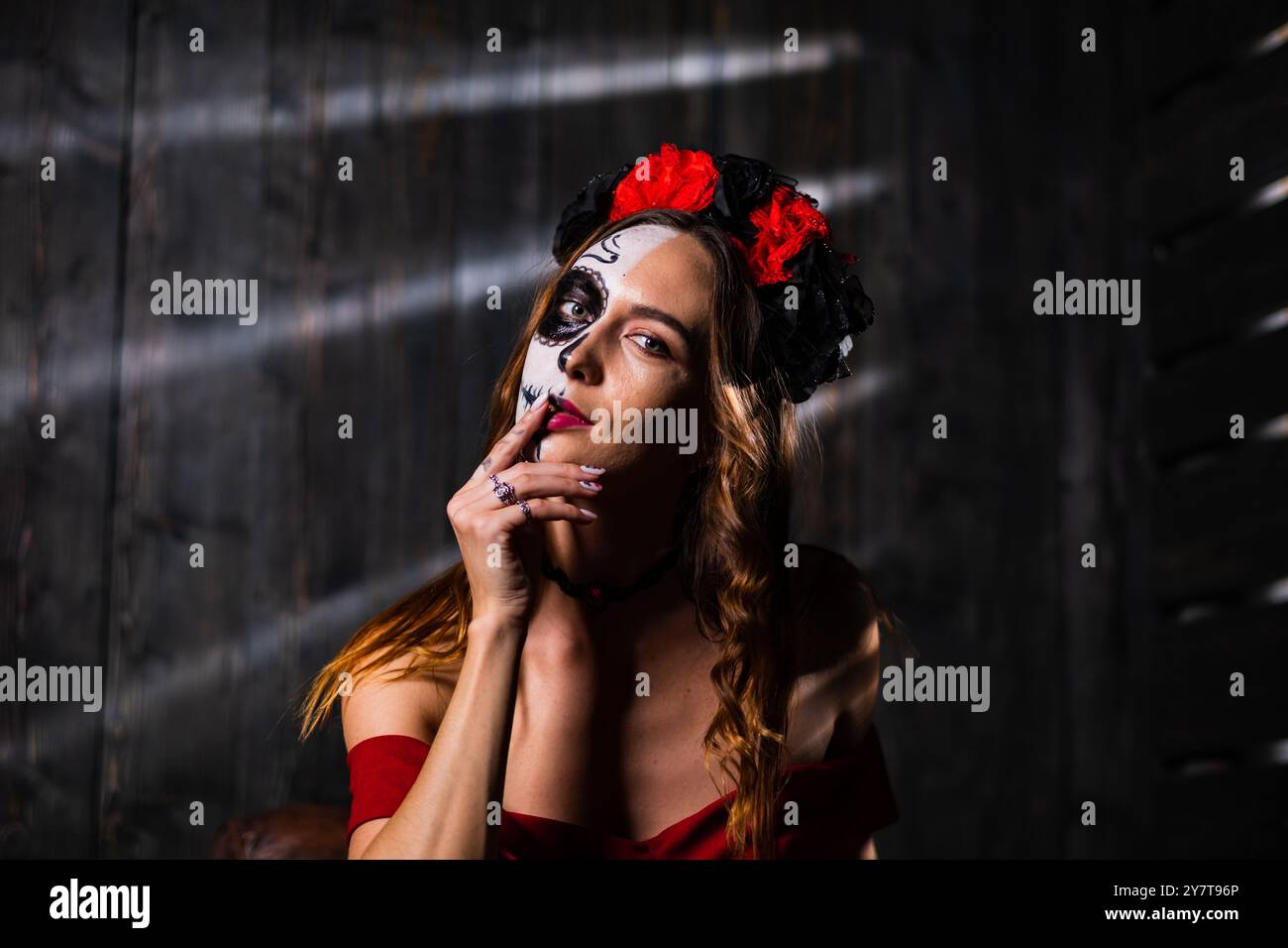 Woman dressed for Dia de los Muertos with intricate sugar skull face ...