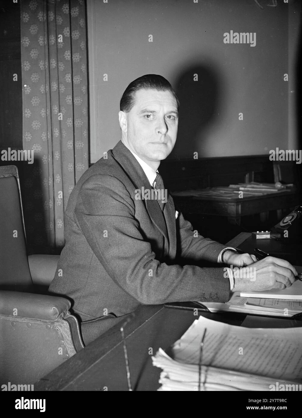 TREASURY'S NEW ECONOMIC SECRETARY Pictured at his desk in the Treasury ...