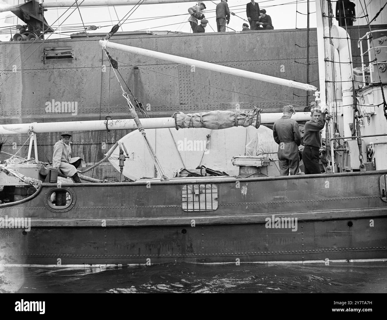 COMRADELY SMILE 21 May 1950 A Russian seamen (right) has a hearty ...