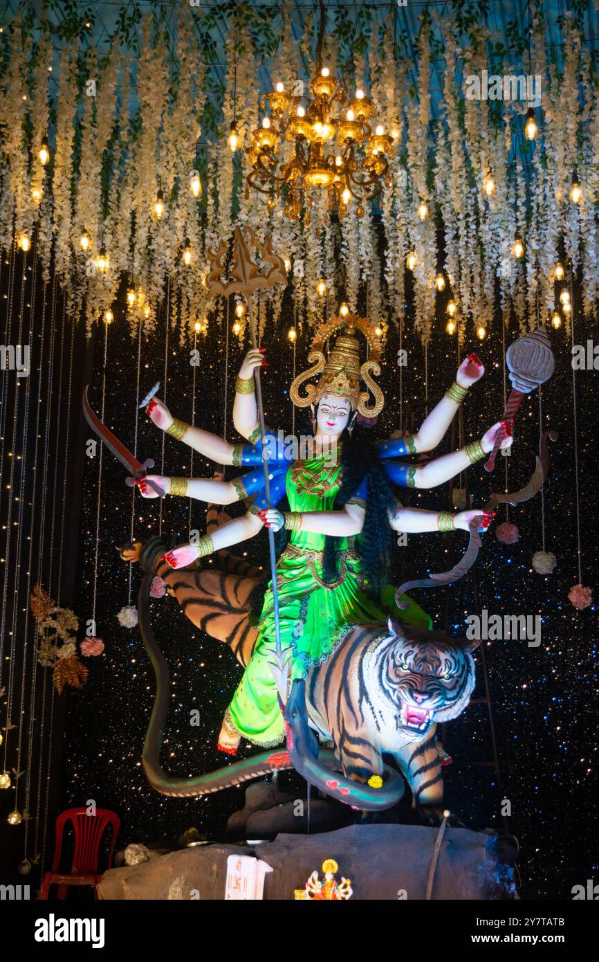 A beautiful idol of Maa Durga being worshipped at a pandal during ...