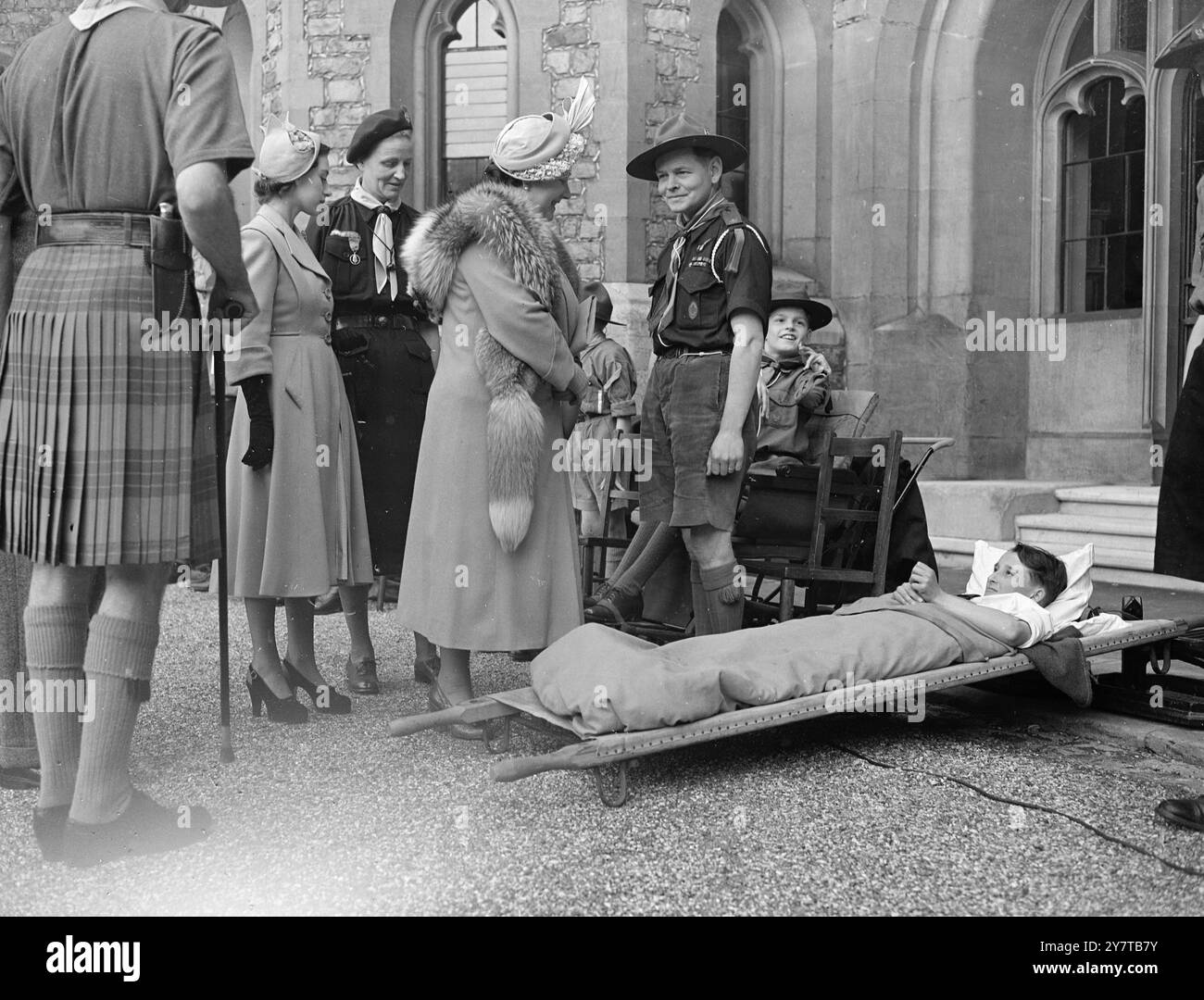 QUEEN TALKS TO SCOUT ON STRETCHER AT ST GEORGE'S DAY PARADE 23 April ...