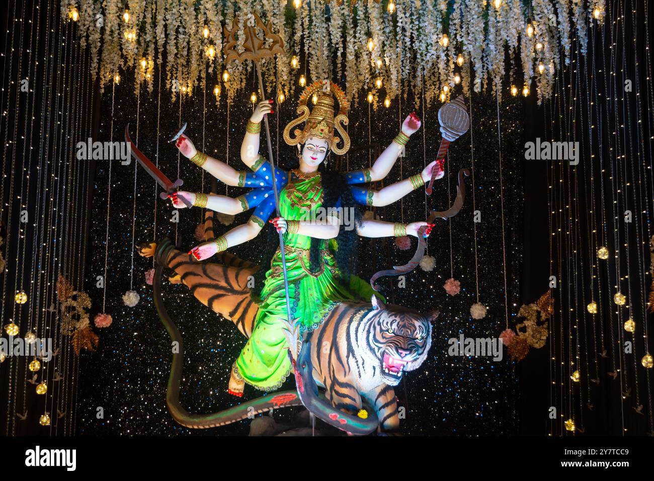 A beautiful idol of Maa Durga being worshipped at a pandal during ...
