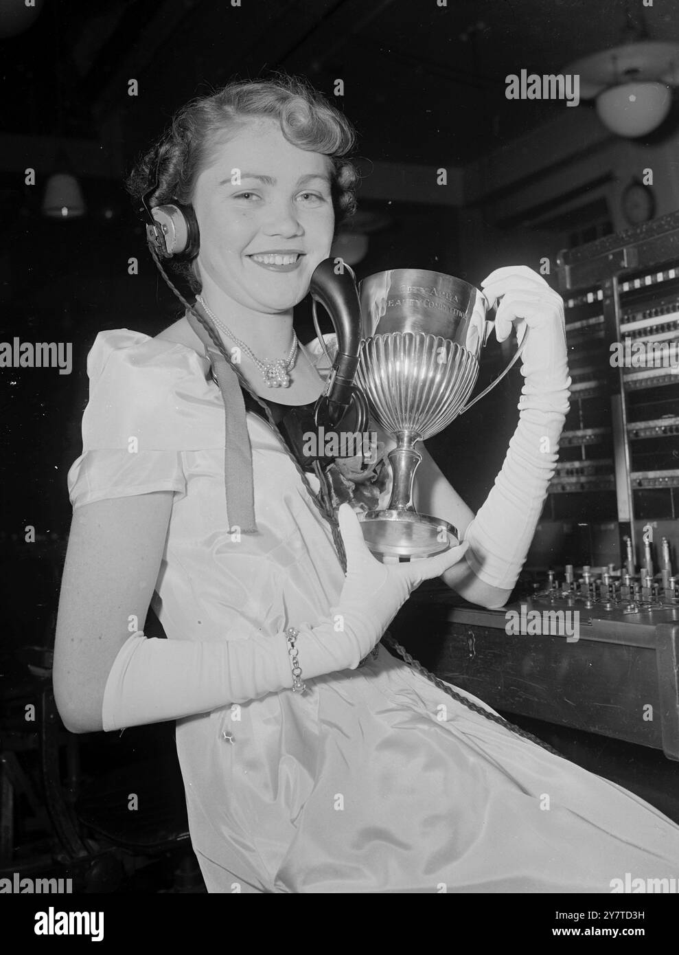 BEAUTY SPEAKS - MAKES HER A ' QUEEN ' Holding her silver trophy tonight ...