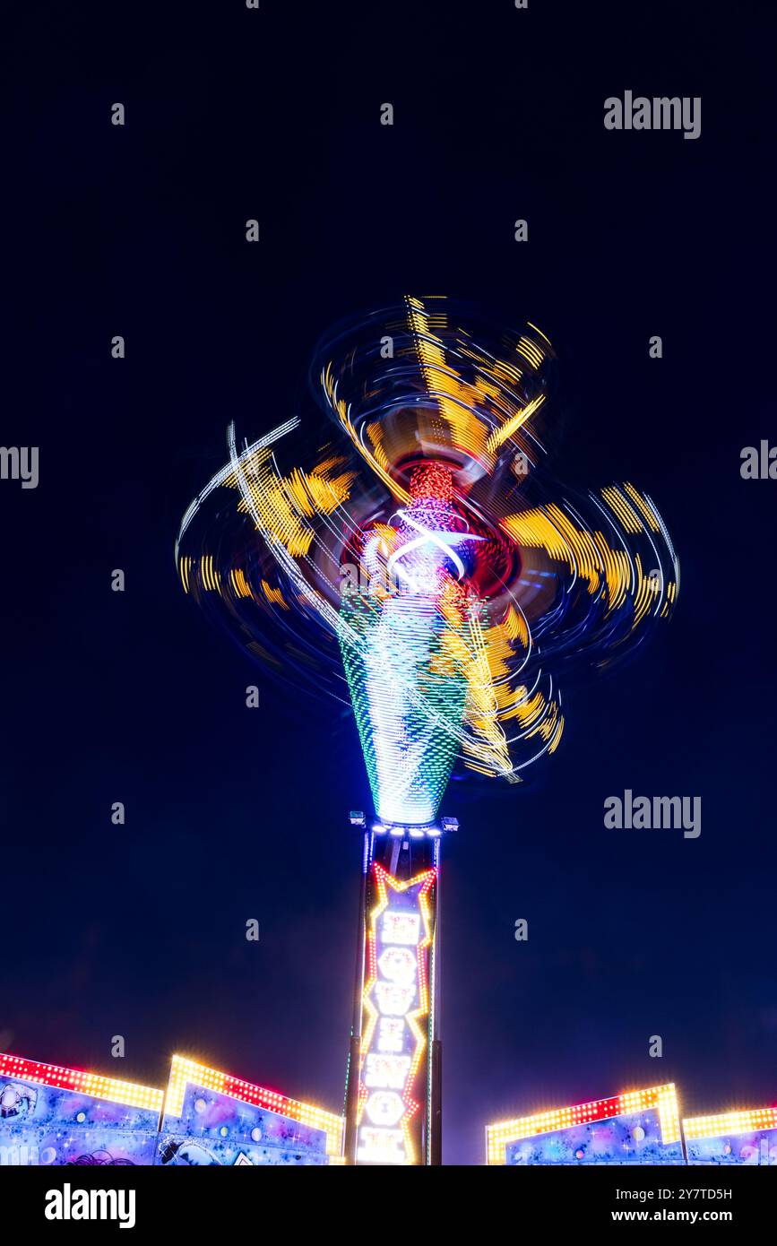 Light traces from the 'Equinox' fairground ride at the annual 'Witney ...