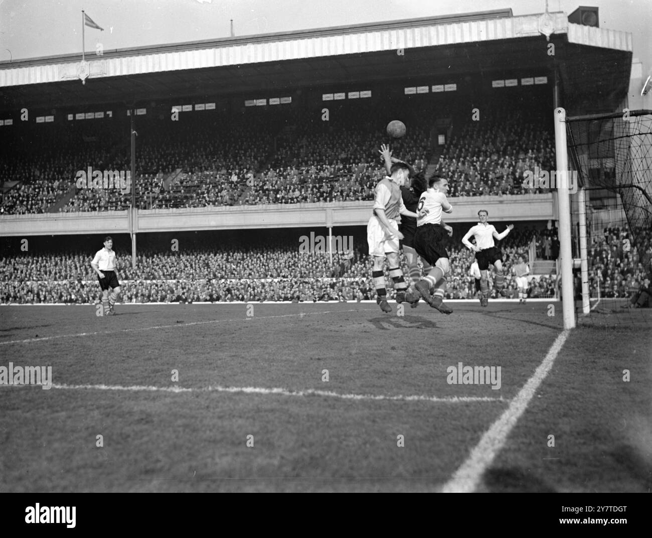 TRIPLE TRY It was a triple effort to reach the ball by Arsenal's inside ...