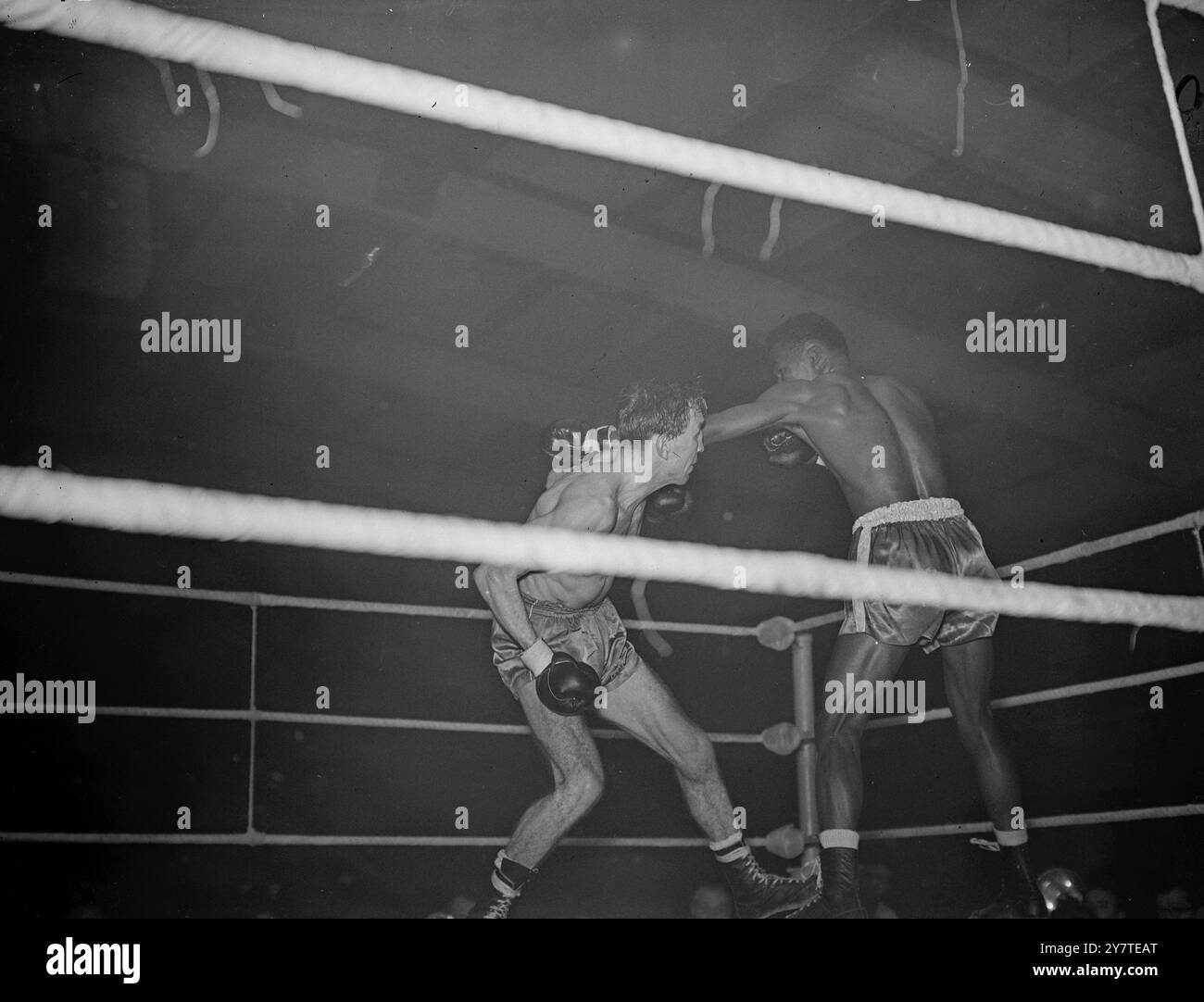 SLIPPING OUT OF DANGER ROGER BAOUR , lightweight champion of France, slips a left from Allen ...