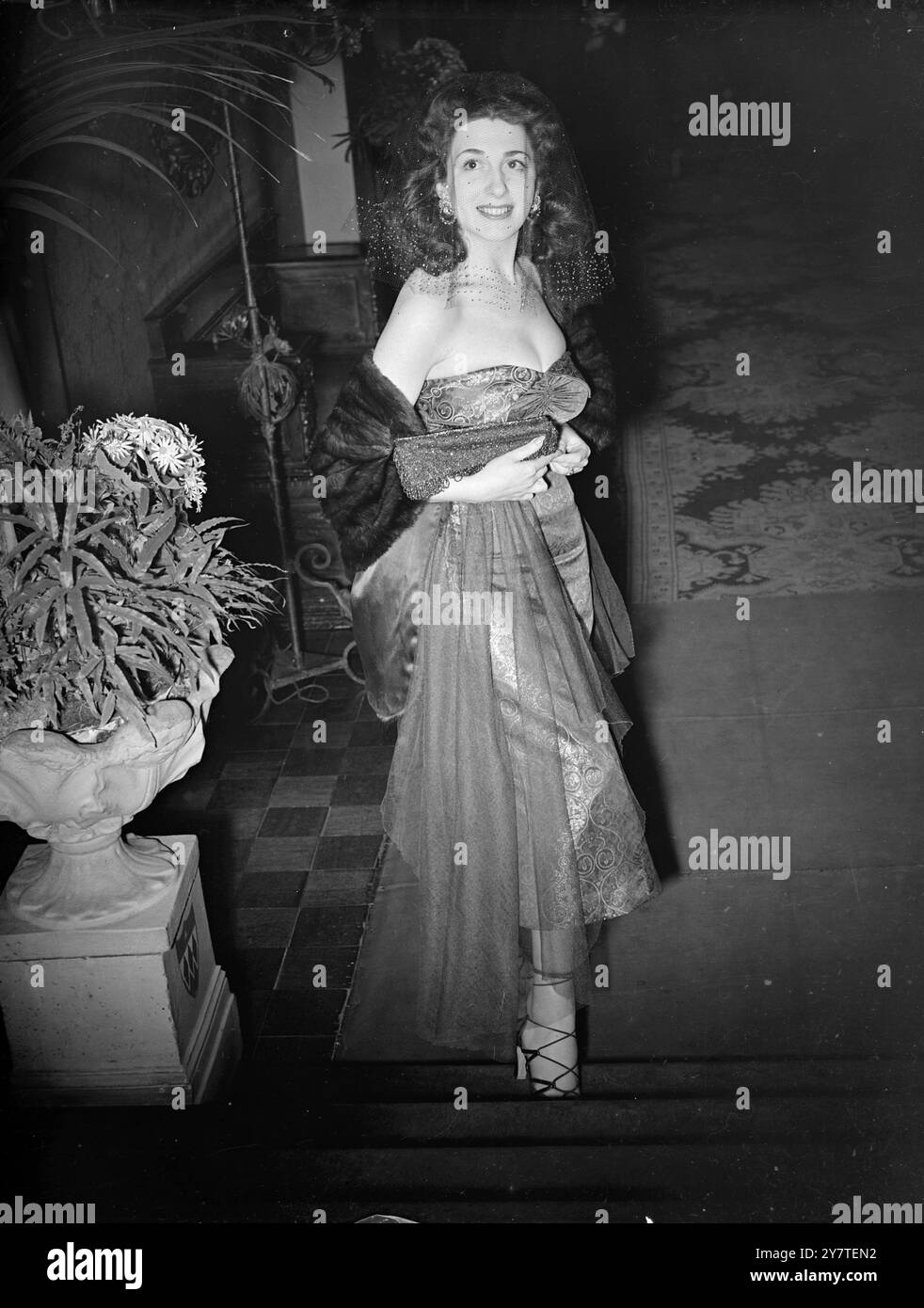 FIGURED GOWN Film actress EDANA ROMNEY wears a gown in bronze and dust ...