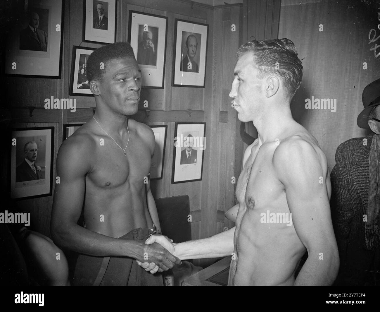THEY BATTLE TONIGHT Shaking hands during the weigh in ceremony today (Tuesday) at the British ...