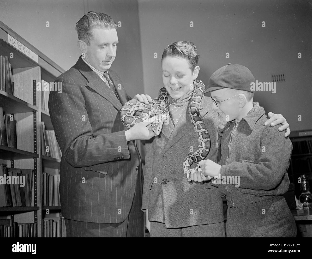 Child holding snake zoo Black and White Stock Photos & Images - Alamy