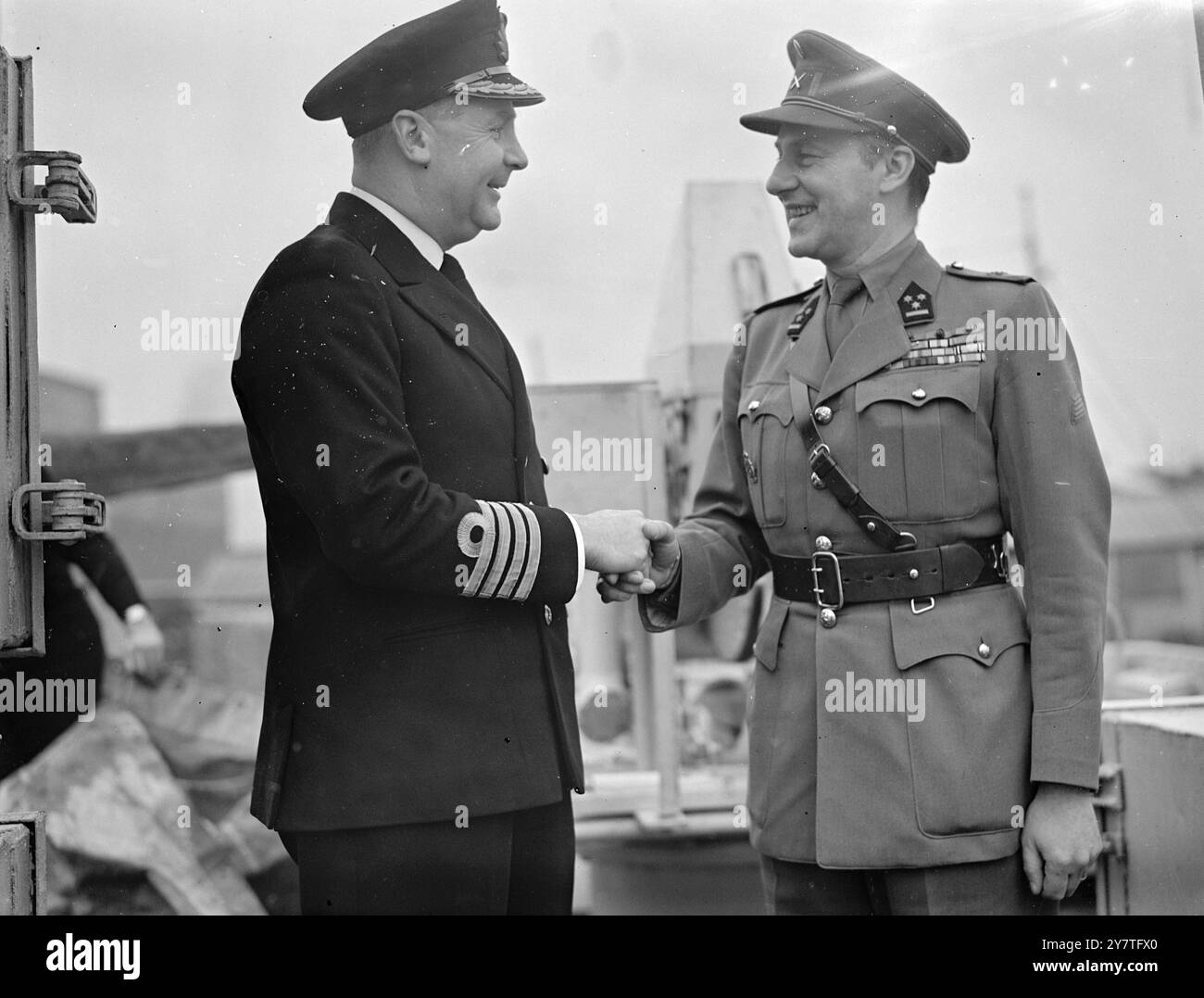 HAND SHAKE AT THE HAND OVER 31 January 1950 The HMS Cadmus, an Algerian ...