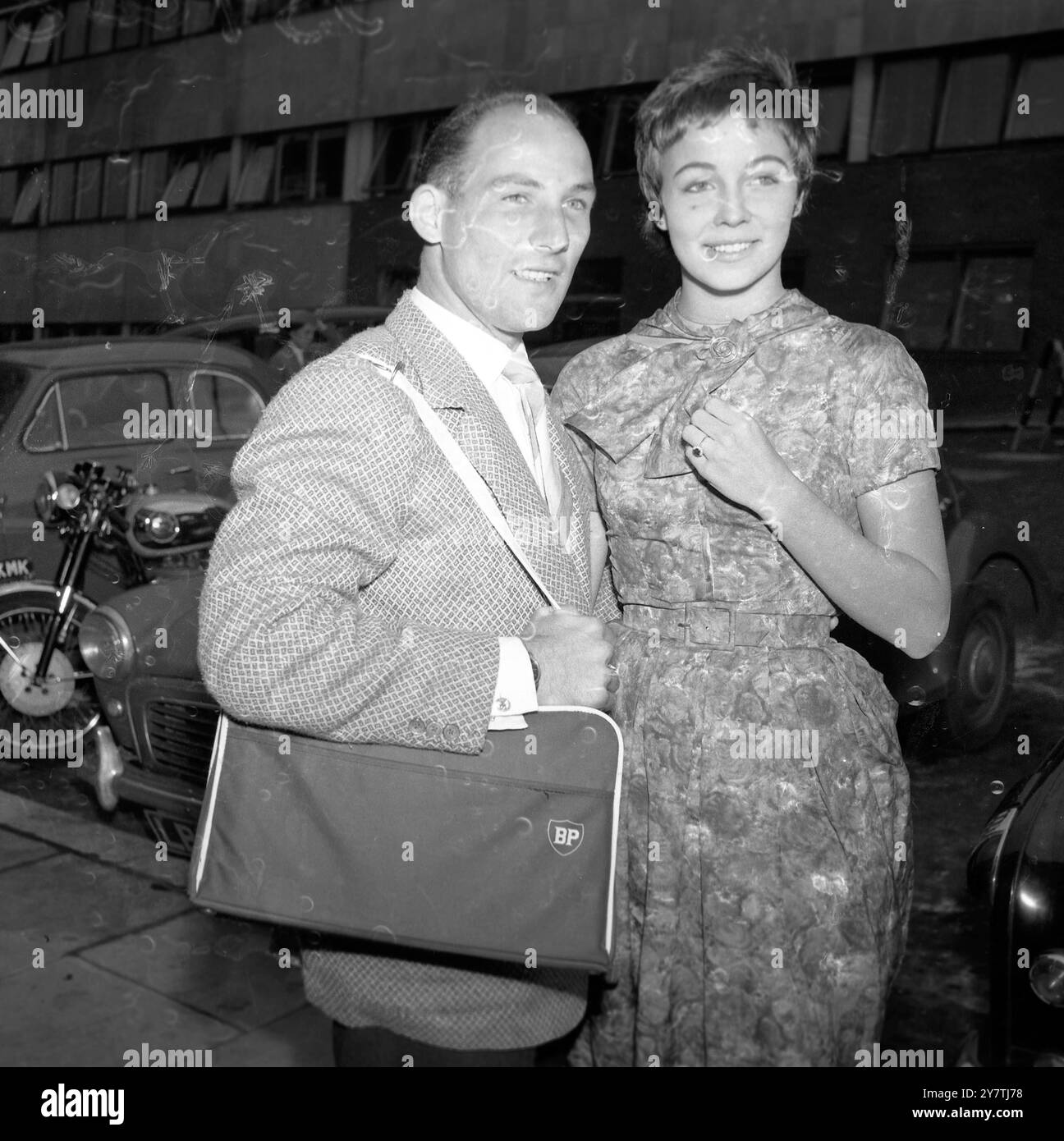 Stirling Moss with his fiancee Katie Molson, aged 22, at London Airport ...