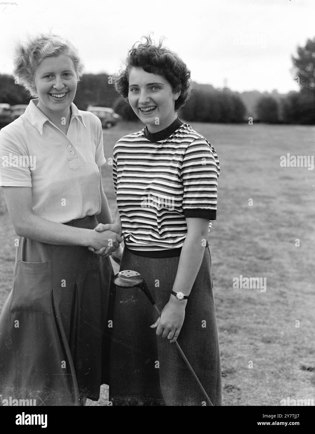 Mlle Arlette Jacquet ( in striped jumper , right) of Belgium , shakes ...