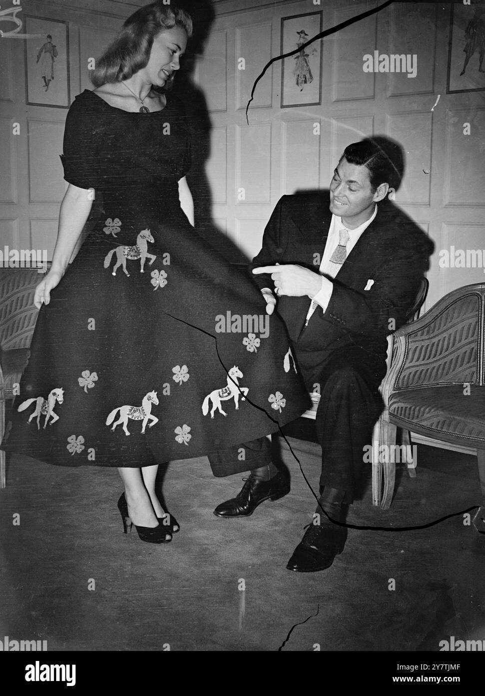 Former film " Tarzan " Johnny Weissmuller admiring inspects his wife's ...