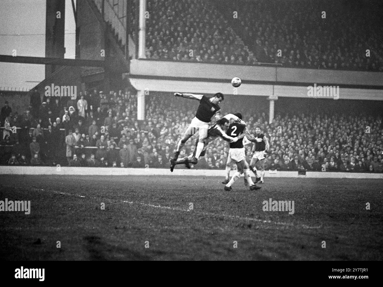 Leicester City's outside left Mike Stringfellow (centre) is about to be ...