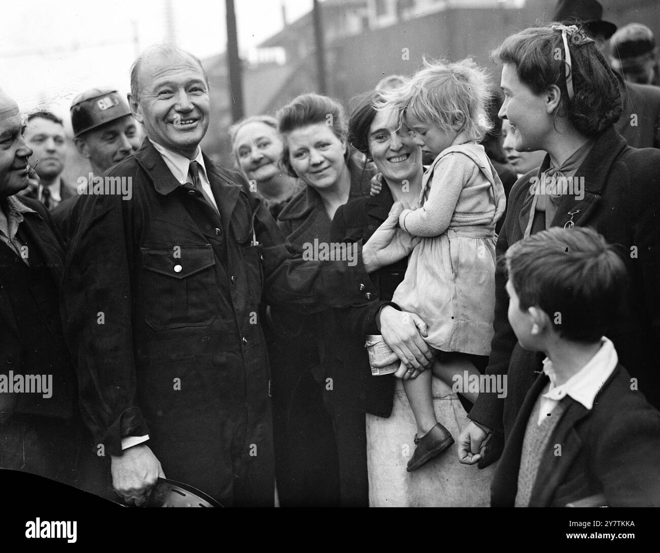 American Ambassador to Great Britain greets a miner's child during ...