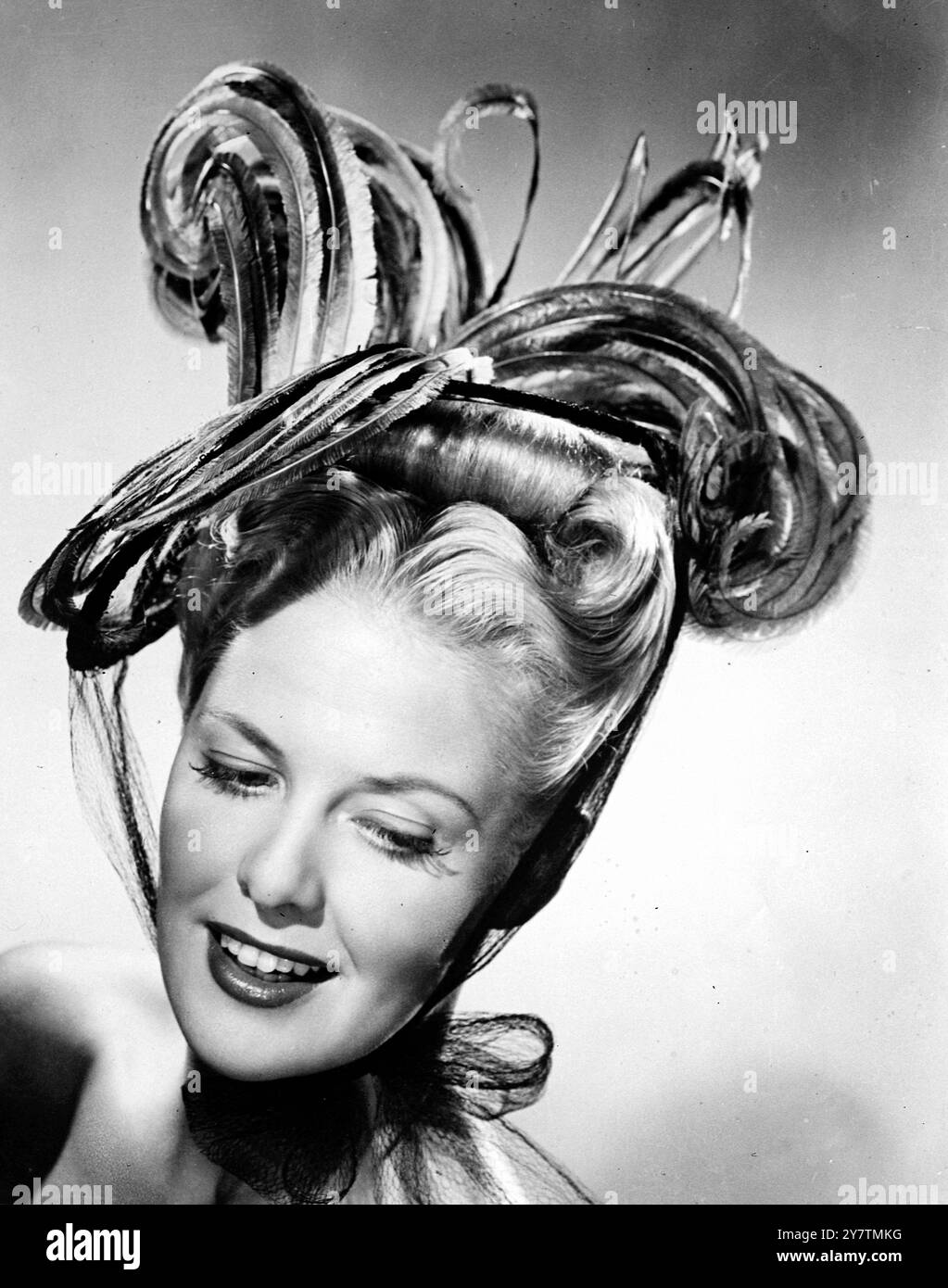 Hat and coiffure tooPhoto shows: Glycerined ostrich feathers used by ...