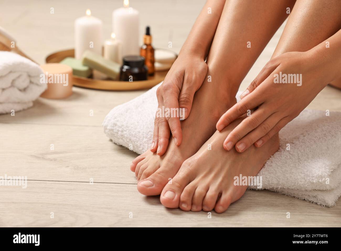 Woman touching her smooth feet on floor, closeup. Body care Stock Photo ...