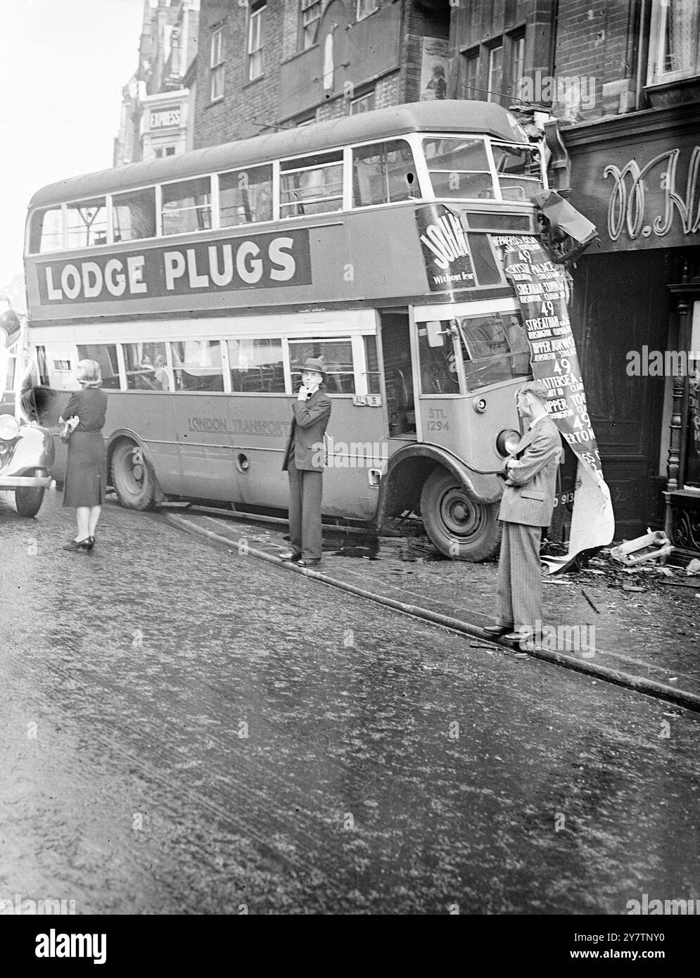 24 INJURED IN BUS SMASH WHEN TROPICAL STORM HITS LONDON Paving blocks ...