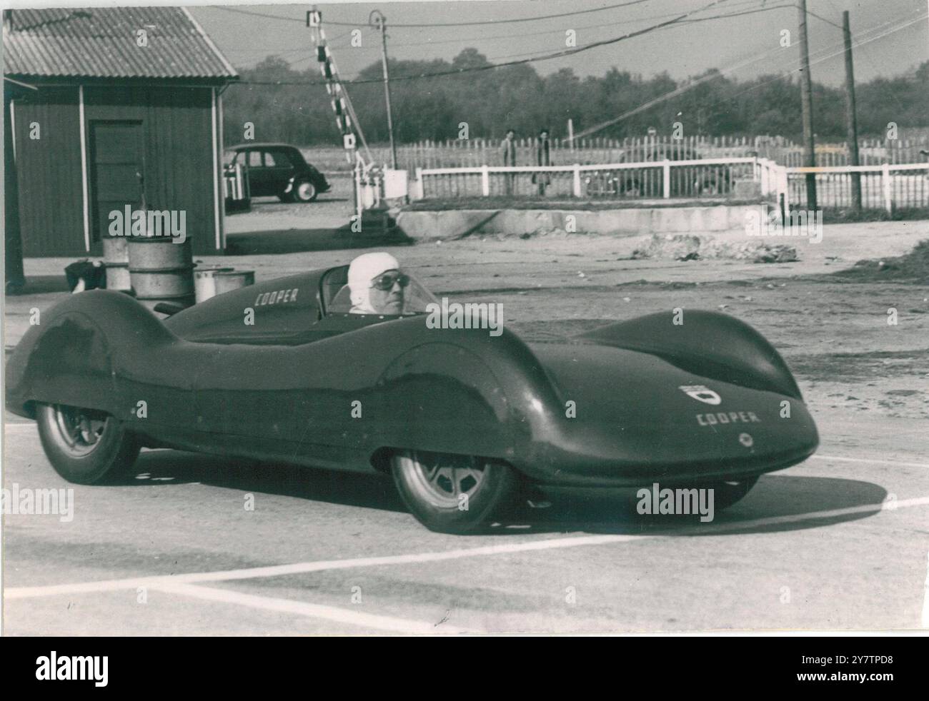 Racing driver John Cooper, 28 years old British motor ace, at the wheel ...