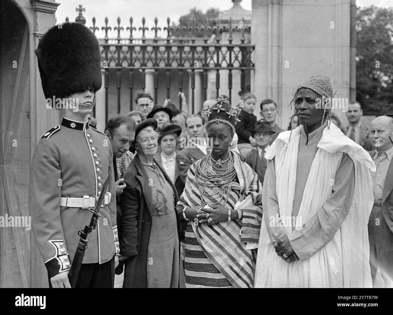 The scarlet uniform and bear skin worn by a sentry on duty outside ...