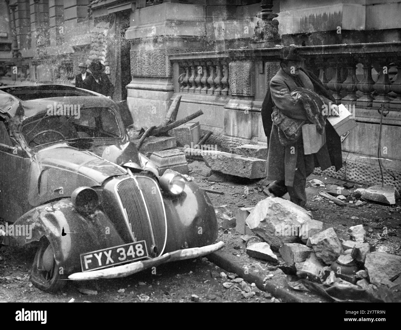 AIR RAID DAMAGE AT THE FAMOUS CARLTON CLUB Photo Shows: Blocks of ...