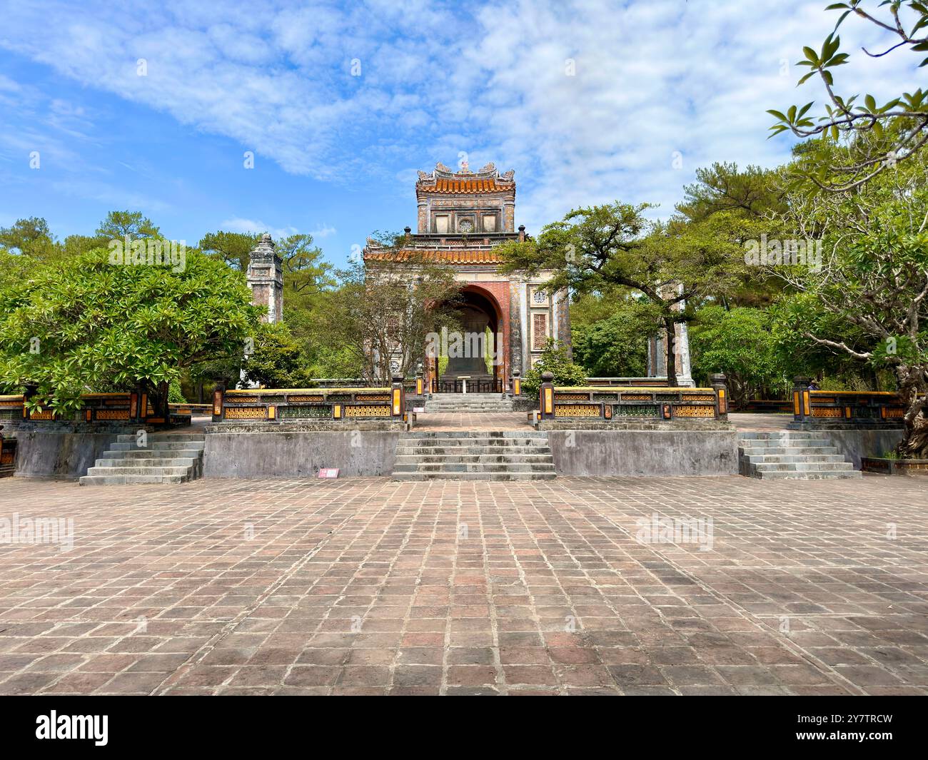 The stele in the tomb of King Tu Duc. A serene courtyard with an ornate ...