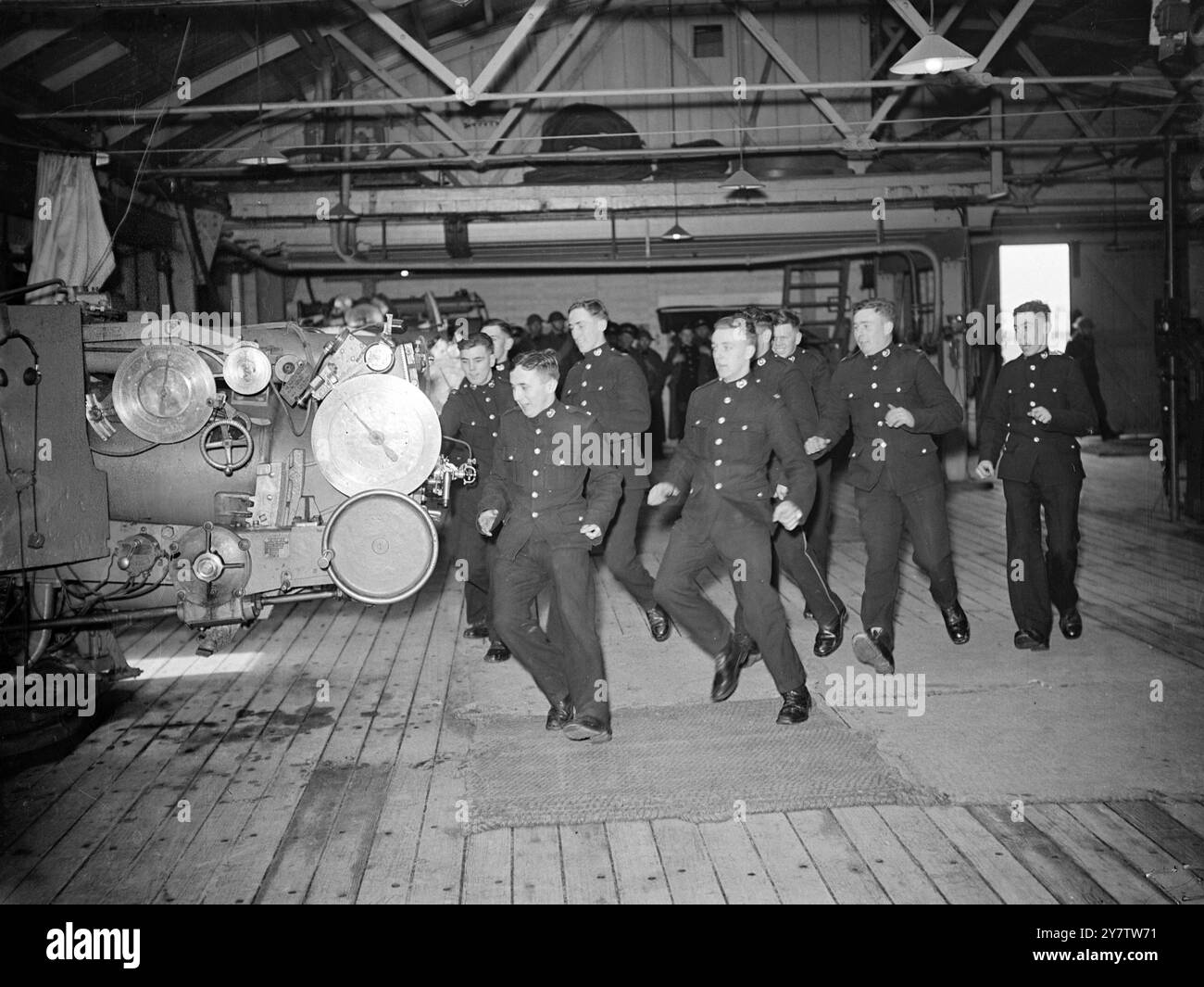 "ACTION STATIONS" Photo Shows: Gun crews run up to "stations" during ...