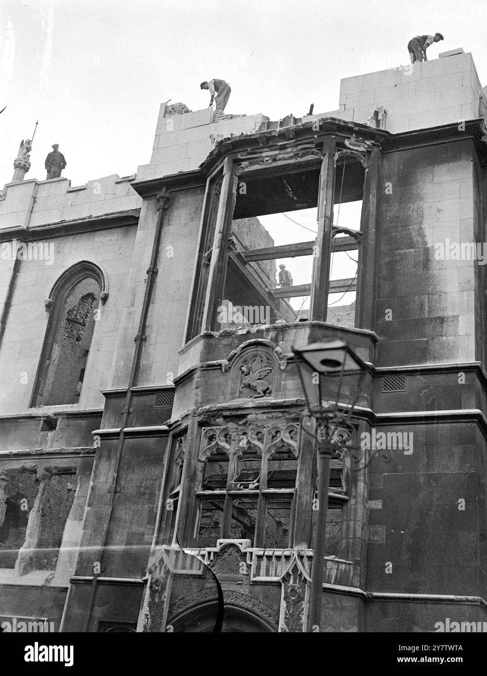 DEMOLISHING THE TEMPLE RUINS Demolition squads are hard at work pulling ...