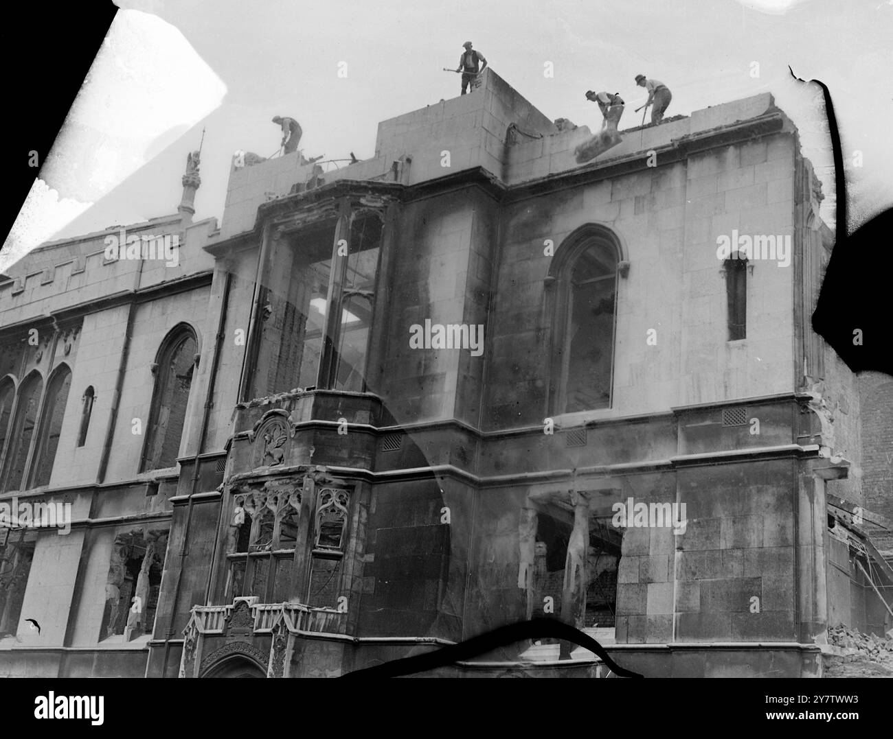 DEMOLISHING THE TEMPLE RUINS Demolition squads are hard at work pulling ...