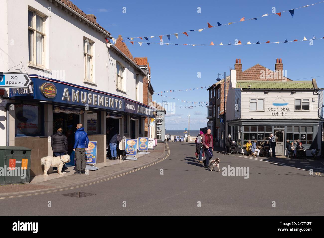 High Street scene in the seaside town and holiday resort of Sheringham ...