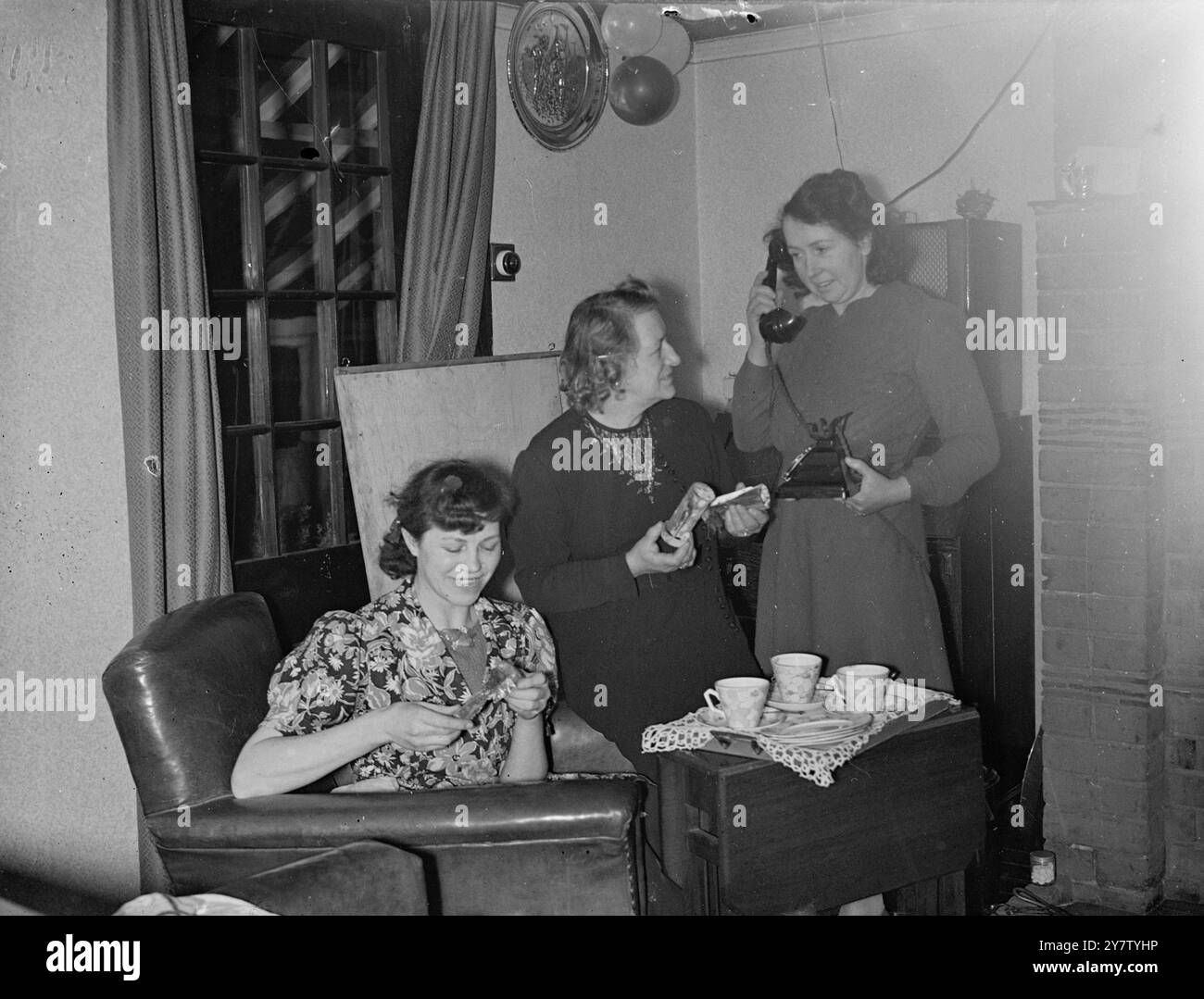 WIVES LEAVE THEIR WORK TO EXTINGUISH FIRE BOMBS Housewives in a London ...