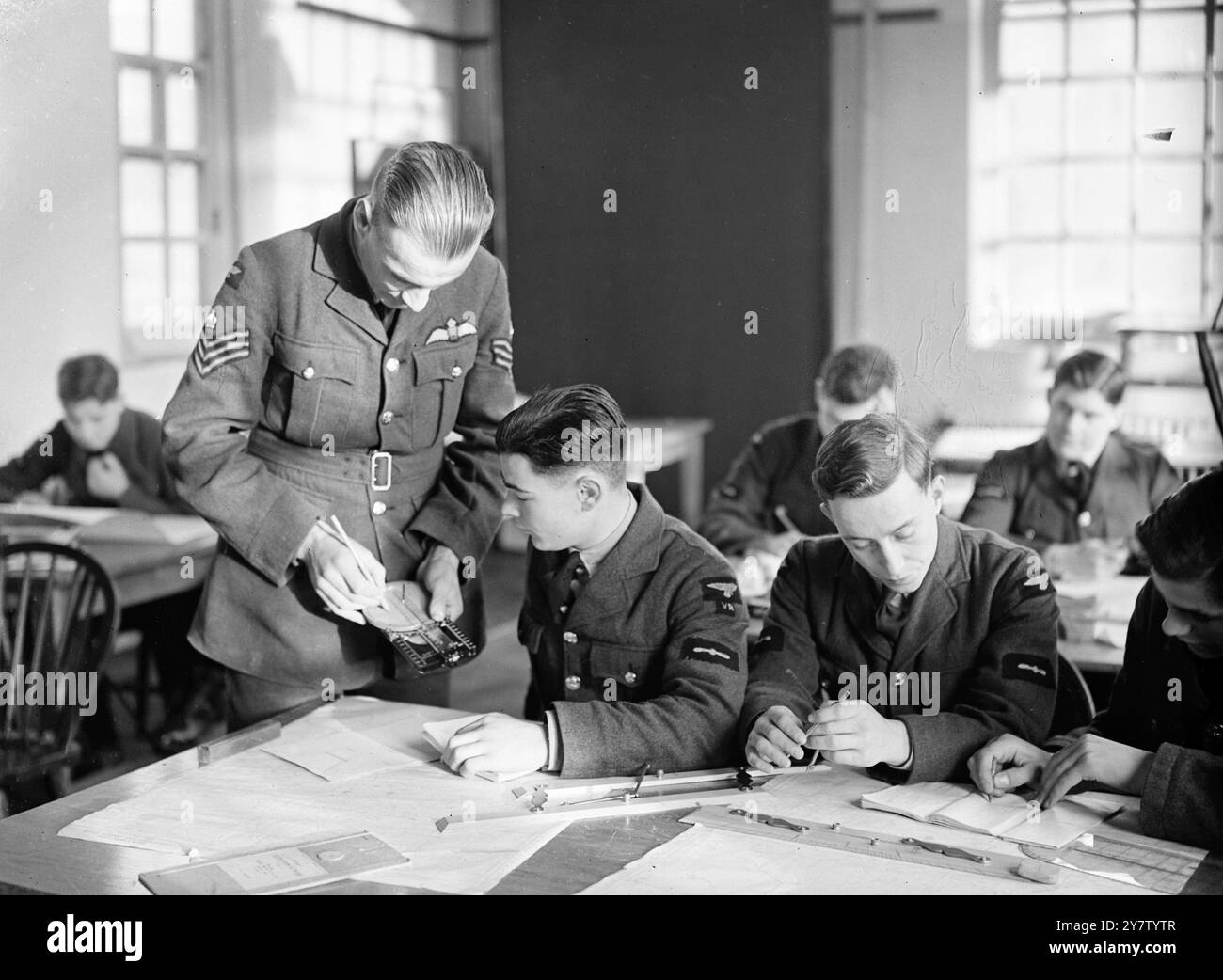 Photo Shows: A class of future airmen interested in an instructional ...
