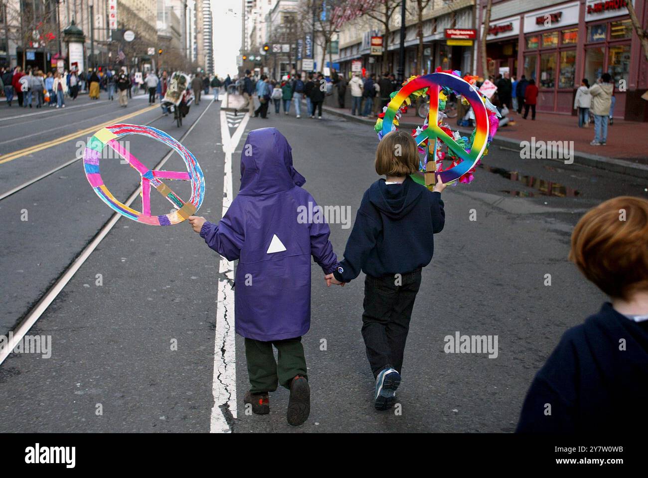 San Francisco, Calif.--Two young protesters hold hands while carrying ...
