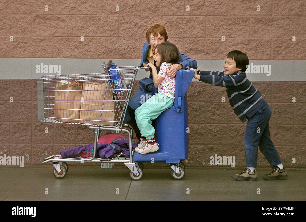 Seattle, WA: -Nicholas Wong uses all his might to push his seven-year ...