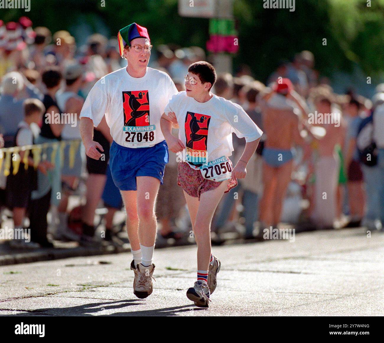 San Francisco, California: Runners and spectators during on Hayes ...
