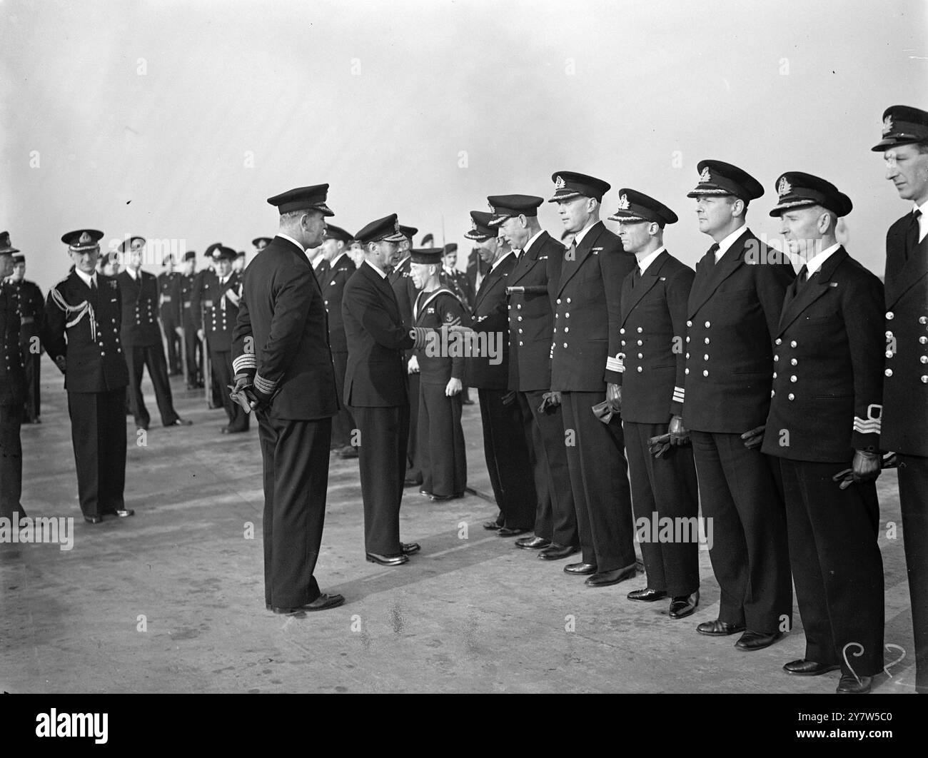 King George VI shaking hands with officers of Aircraft carrier HMS ...