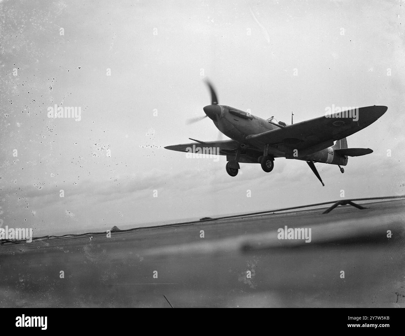 SEAFIRE LANDING Photo Shows: A Seafire landing on the flight deck of ...