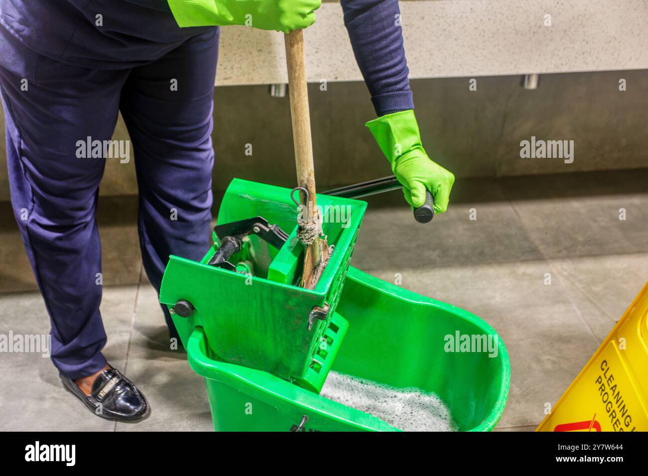 cleaning services woman with a Mop Wringer Bucket, african american ...