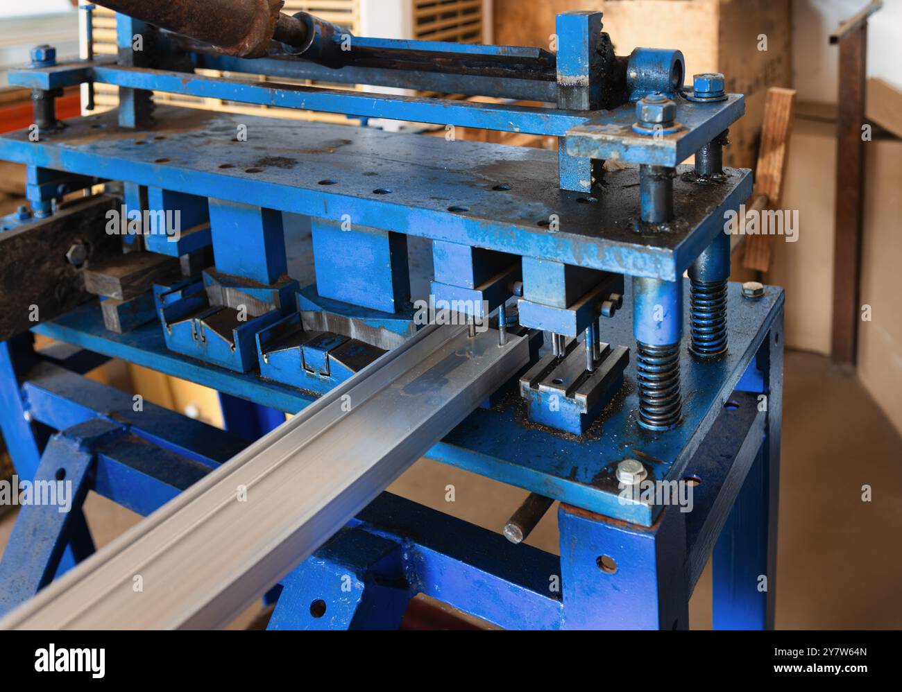 fabricating aluminum windows, machine in the workshop, punching machine ...