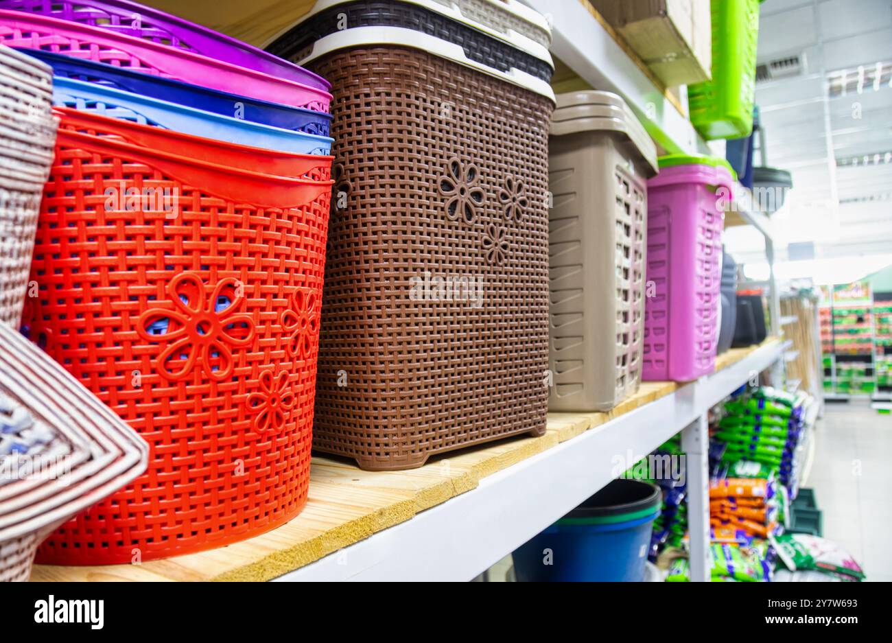 large plastic baskets for sale on the shelves of a general store Stock ...