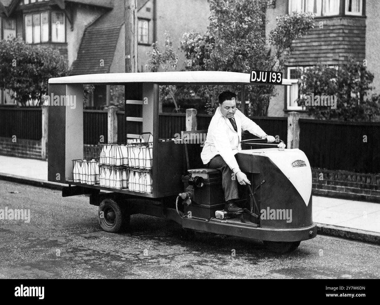 Milkman making his daily rounds on his electric powered float.September ...