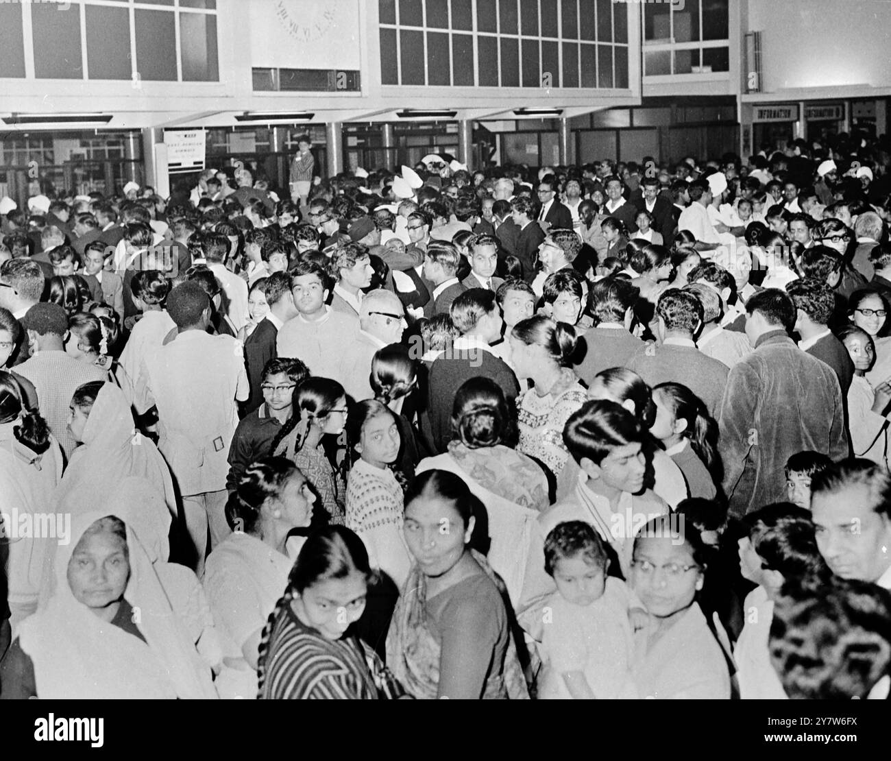 Hundred of Asians many of them children wait at Nairobi Airport 24 ...