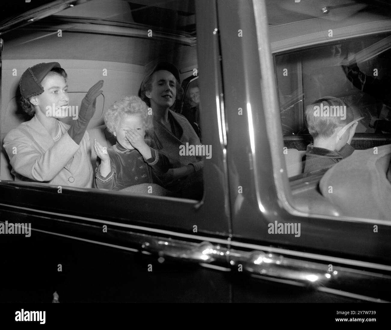 Princess Anne plays peek-a-boo with the photographer .Princess Anne ...