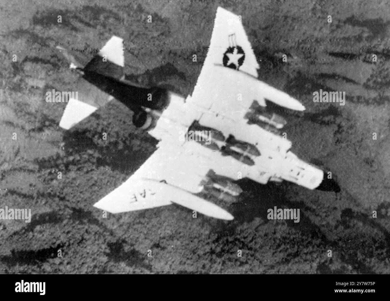 A United States Air Force F-4C Phantom rolls over and dives toward a ...
