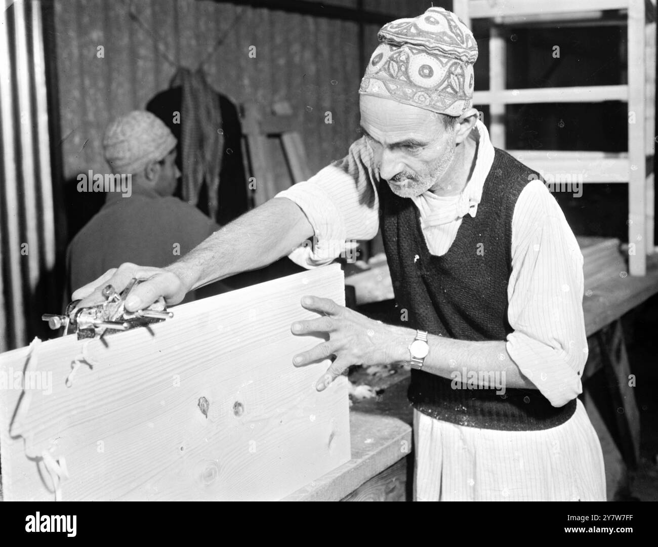 Qatar - 1954 - - PICTURE SHOWS:- Carpenter at Shell's industrial site ...